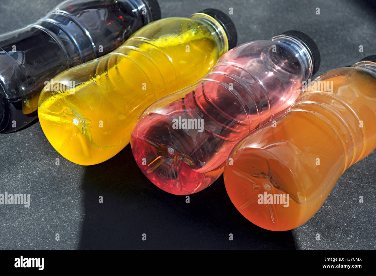 plastic bottles with colored liquid Stock Photo - Alamy