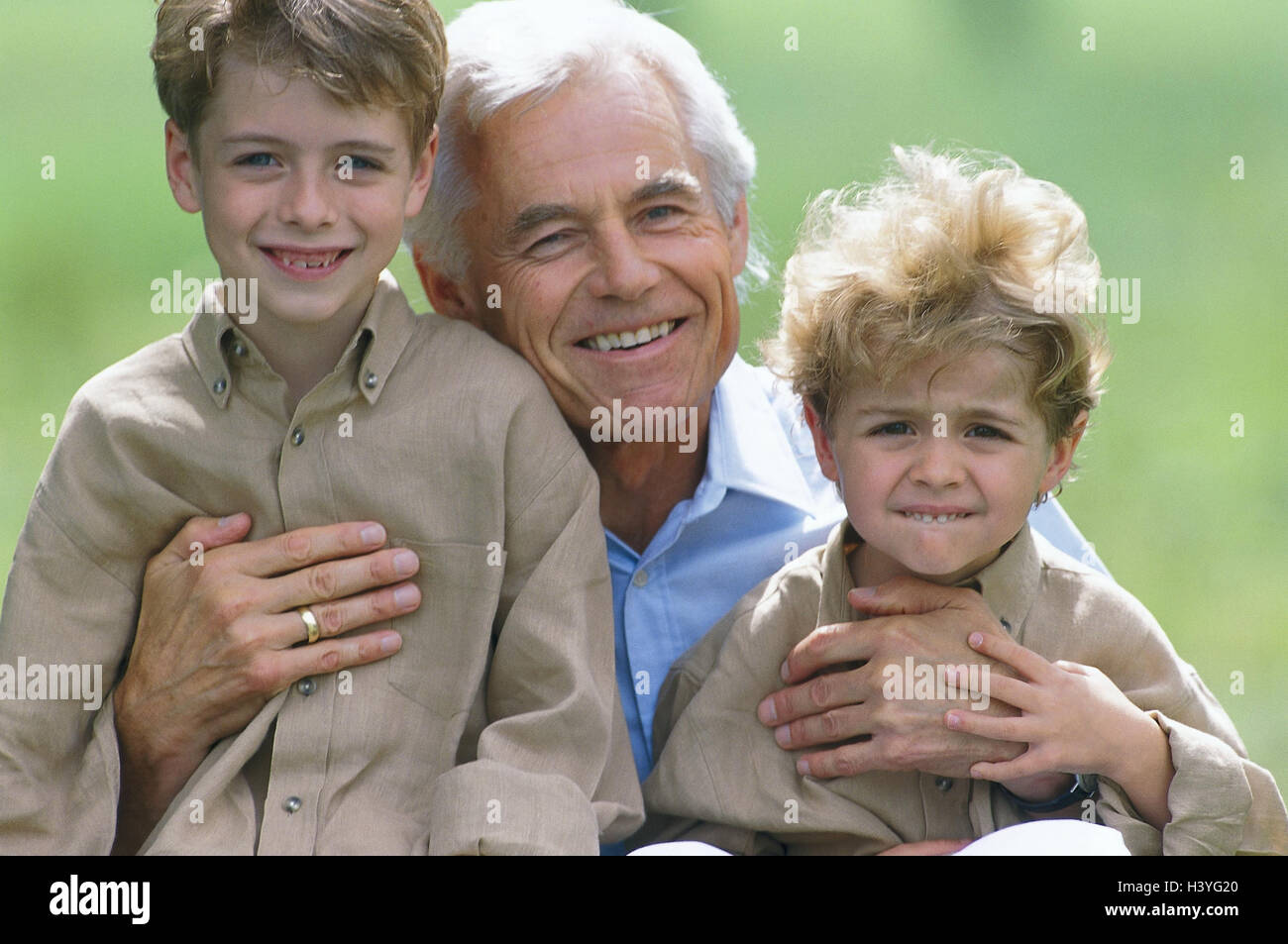 Grandfather, grandsons, laugh, embrace group picture, model released ...