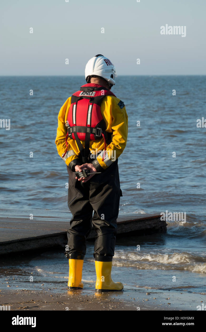 Member of RNLI standing next to the sea at Cleethorpes Stock Photo - Alamy