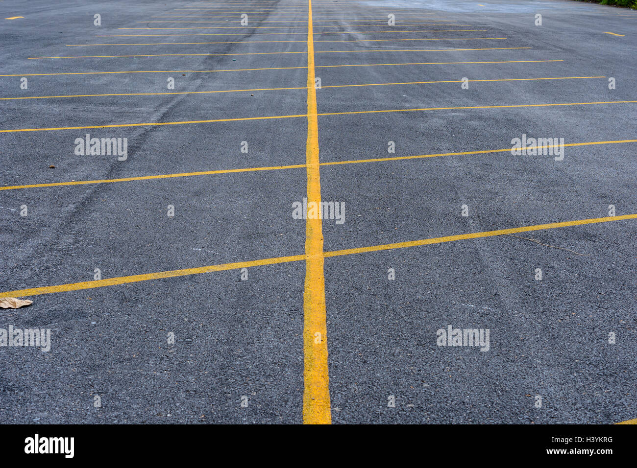 empty parking lot with yellow line Stock Photo - Alamy