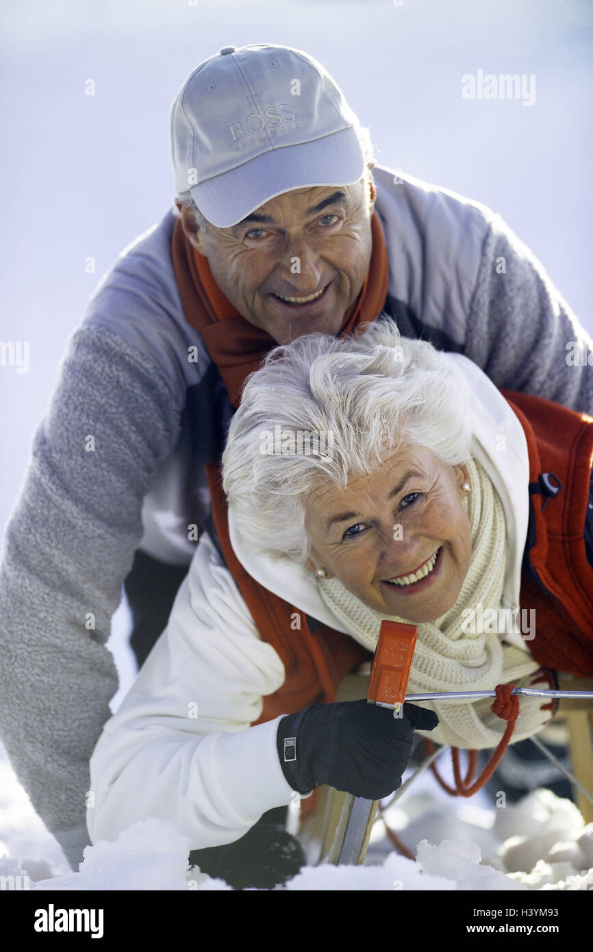 Senior couple, sleigh-riding, happy, curled, 60-70 years, senior ...