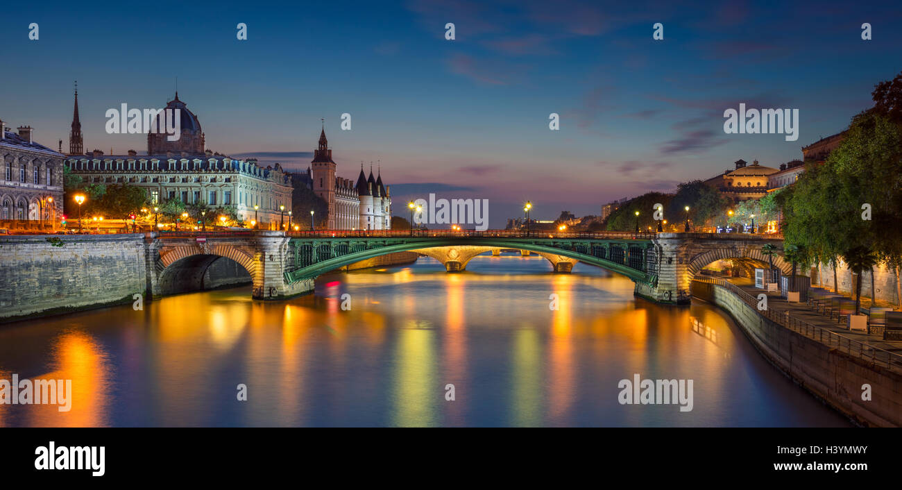 Paris Panorama. Panoramic image of Paris riverside during twilight blue ...