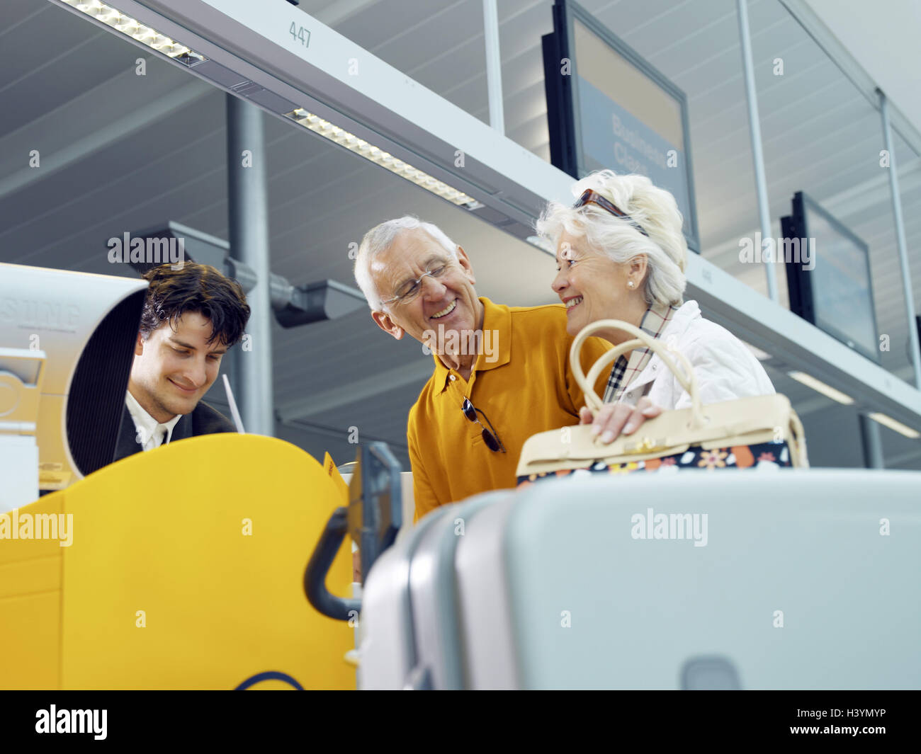 Airport, switch, office worker, senior citizen's couple, check in, hand ...