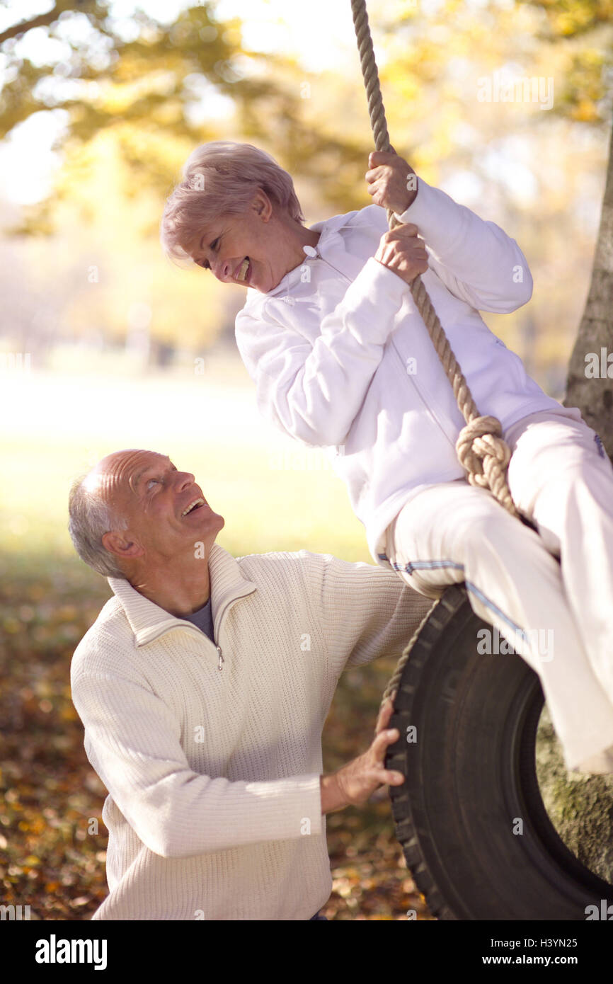 Park, swing, rope, automobile tyre, Senior couple, eye contact, melted ...