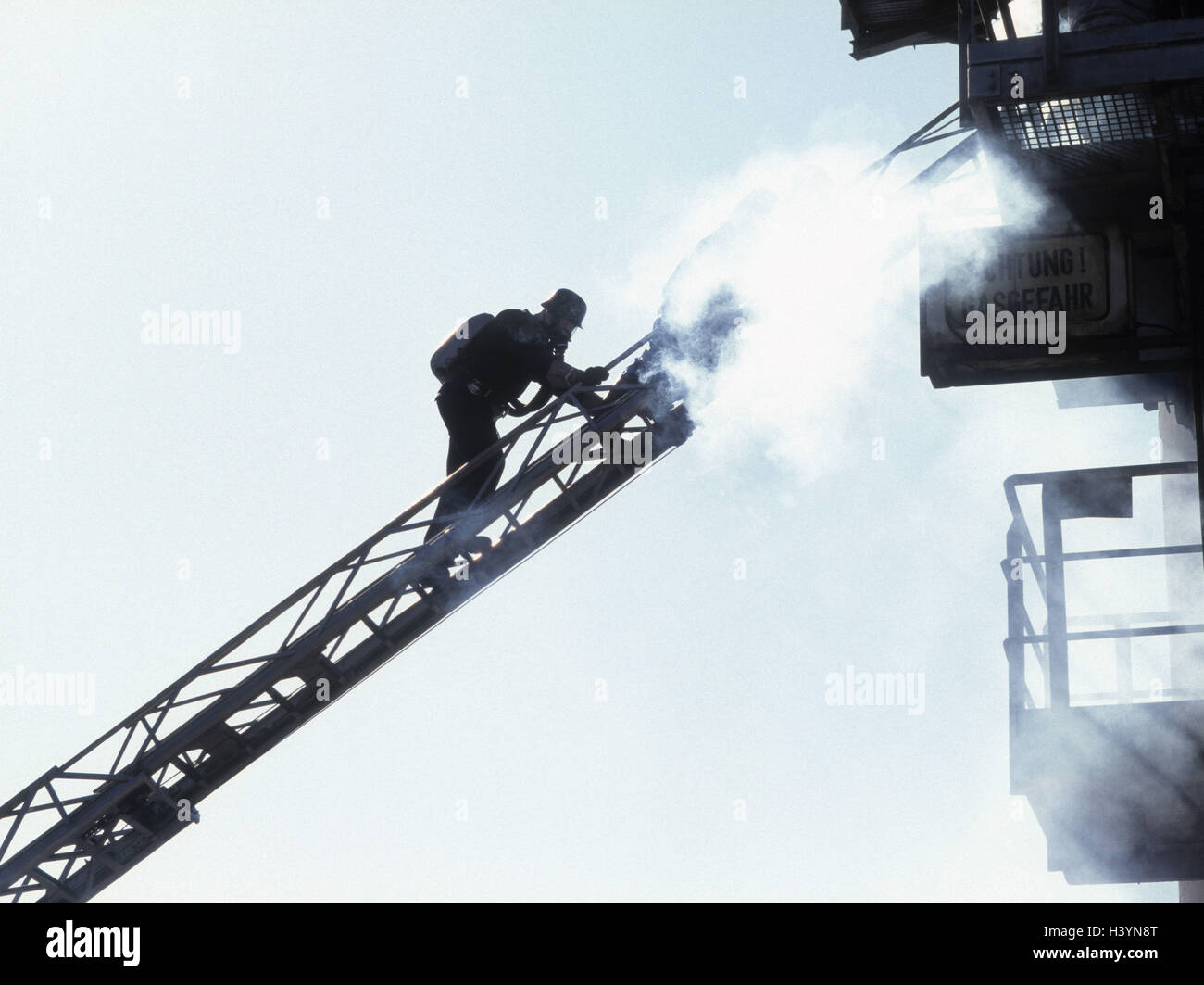 Industrial plant, conductor, firefighter, protective mask, side view ...