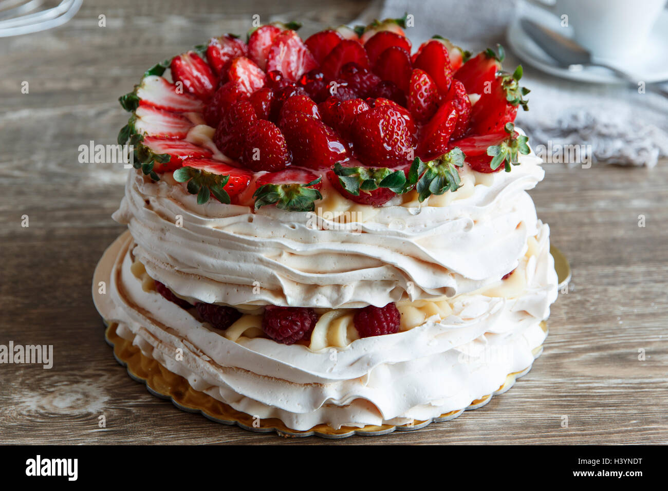 meringue cake with custard and strawberry raspberry Stock Photo - Alamy