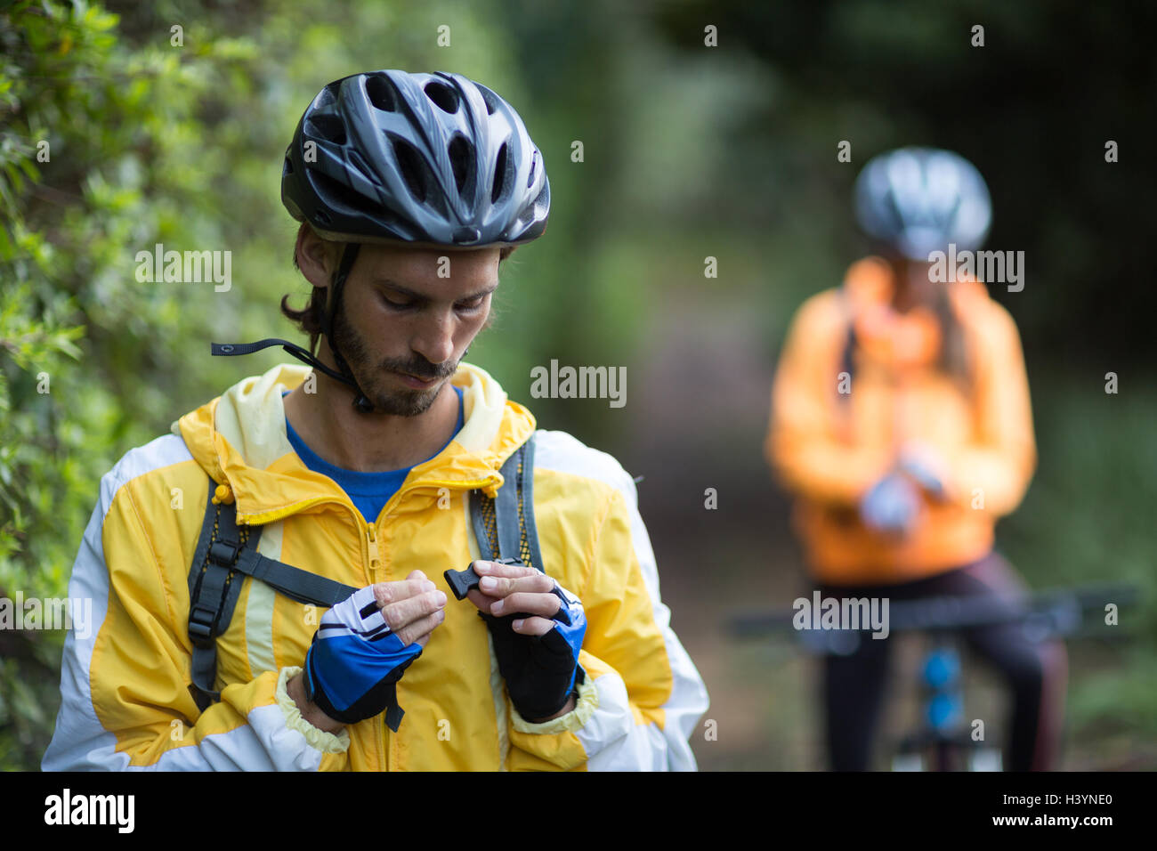Male biker with backpack Stock Photo - Alamy