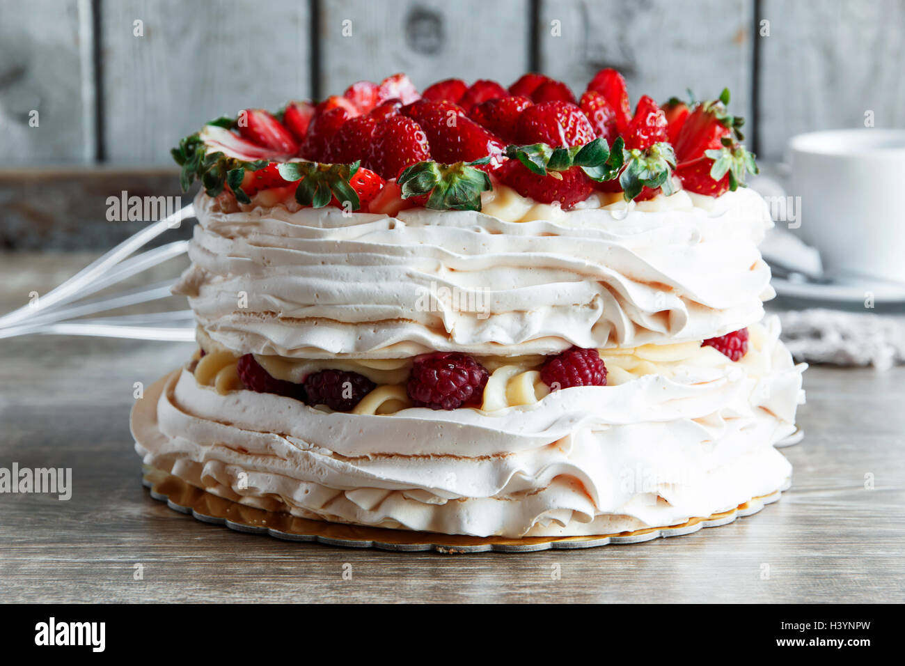 meringue cake with custard and strawberry raspberry Stock Photo - Alamy