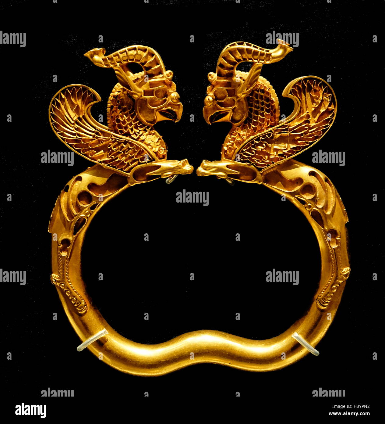 gold armlet from ancient Persia. lion-griffin terminals originally ...