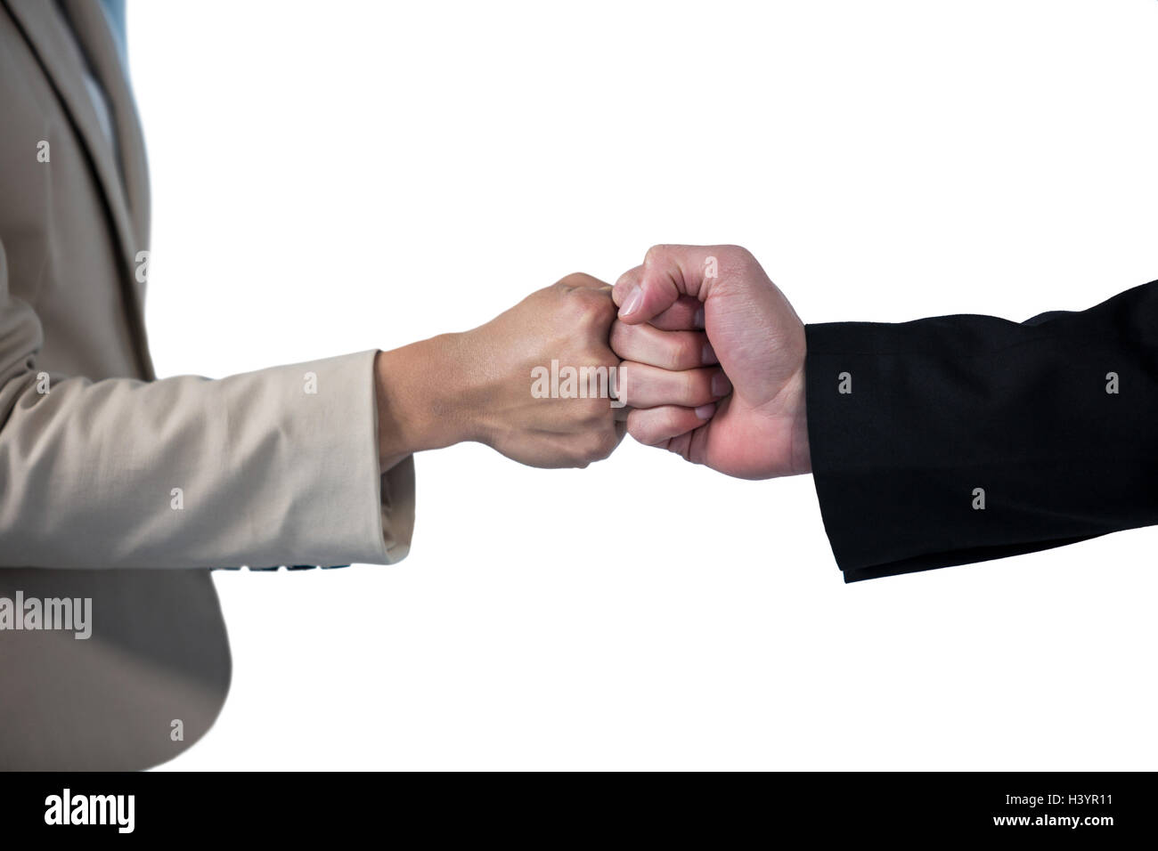 Business people giving fist bump Stock Photo - Alamy
