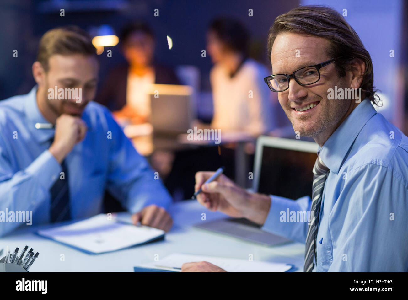 Businessman preparing document in conference room Stock Photo - Alamy