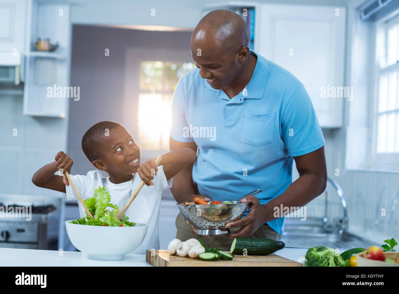 Father and son preparing food Stock Photo - Alamy