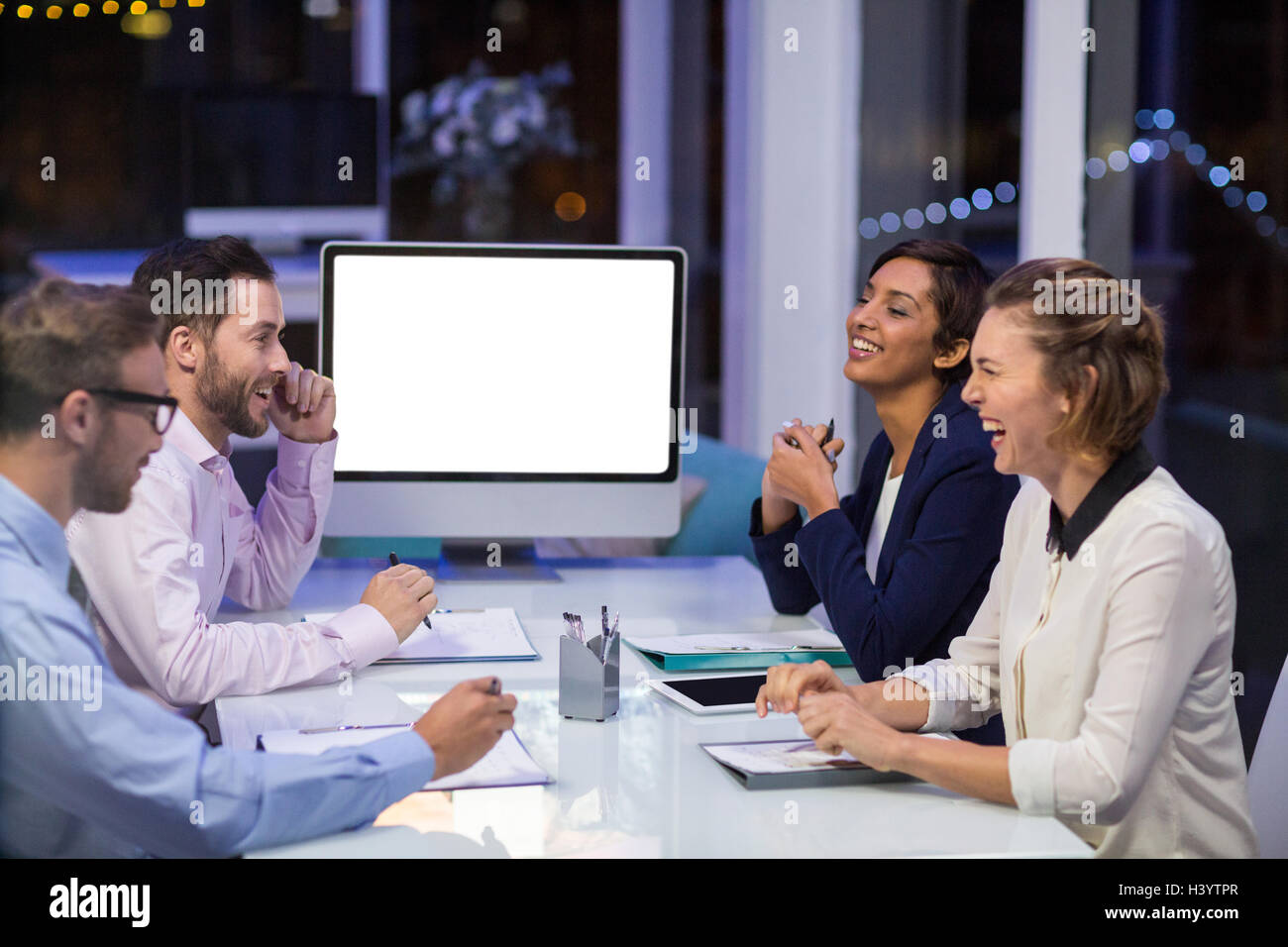 Businesspeople interacting with each other in conference room Stock ...