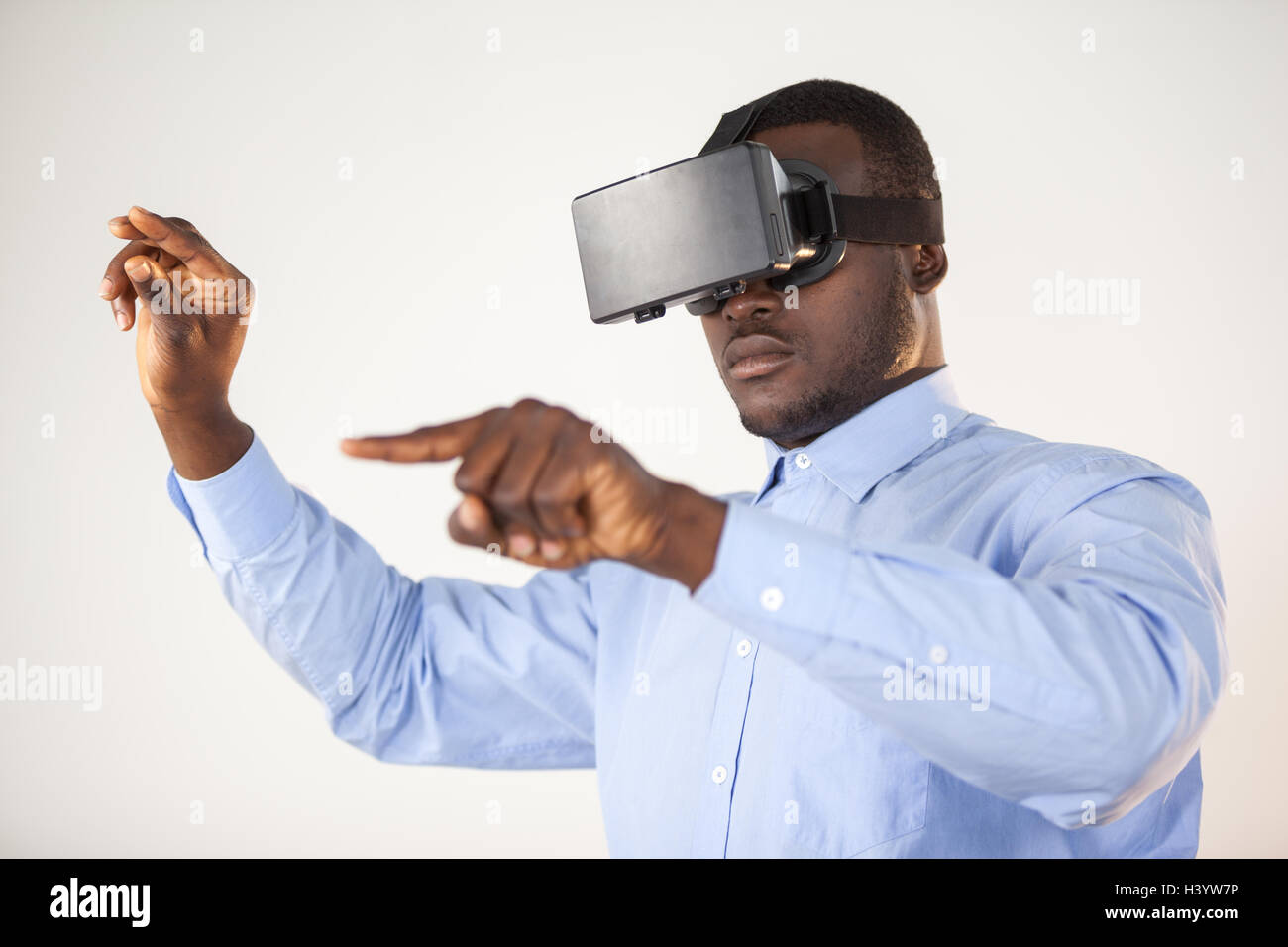 Man using virtual reality headset Stock Photo - Alamy