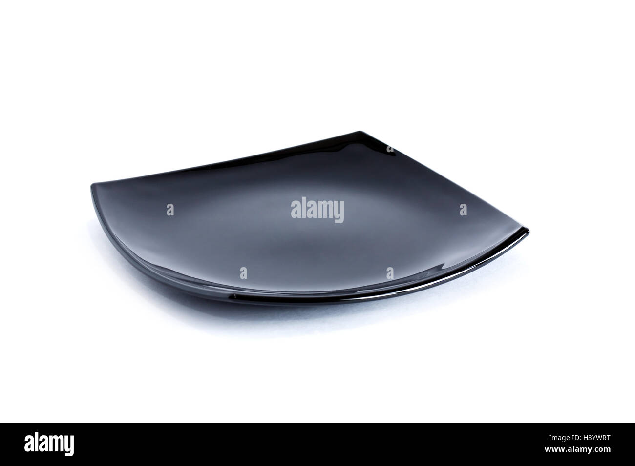 Nice empty black plate against white background Stock Photo - Alamy