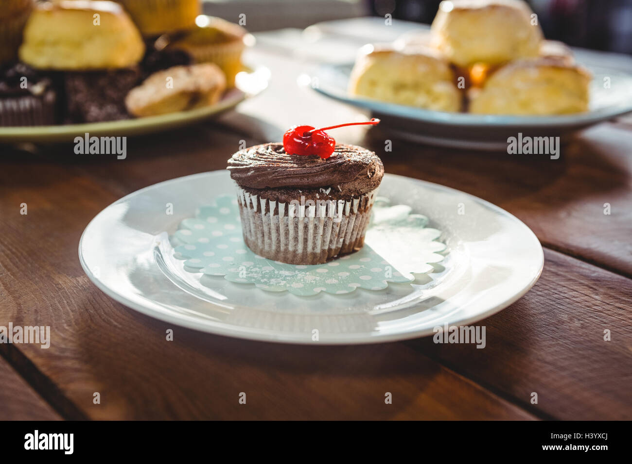 Cupcake on plate Stock Photo - Alamy
