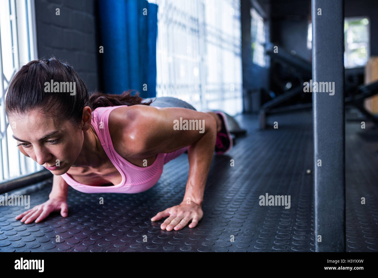 Young woman doing push-ups Stock Photo - Alamy