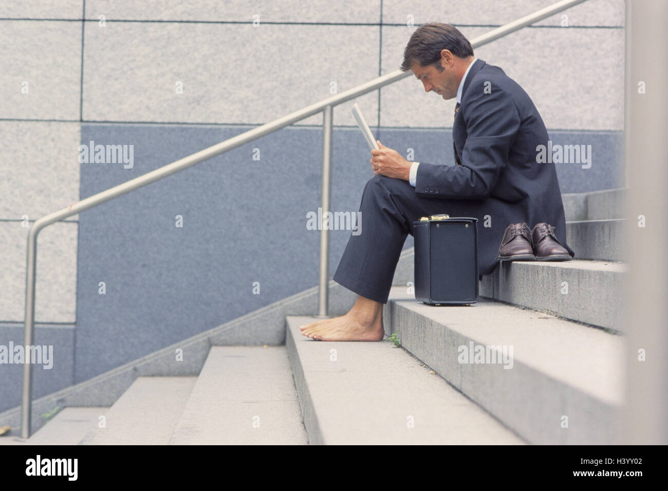 Stairs, businessman, barefoot, work, laptop, side view, occupation ...