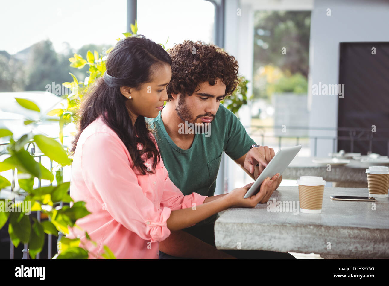 Couple using digital tablet Stock Photo - Alamy