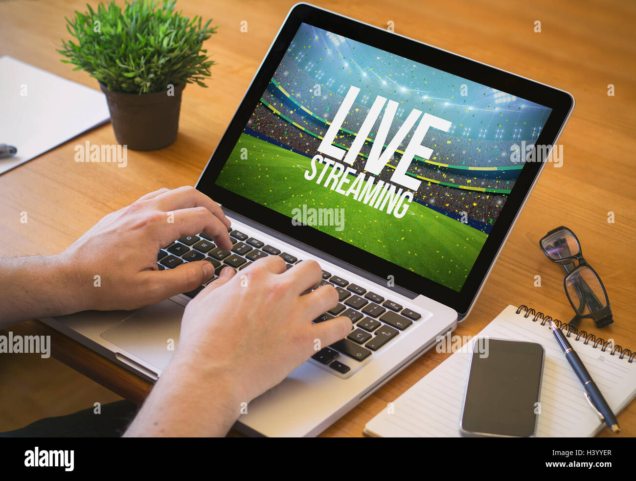 live streaming concept. Close-up top view of a man watching sports ...