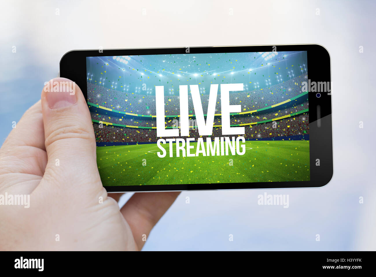 live streaming mobile concept: hand holding an live streaming sports ...