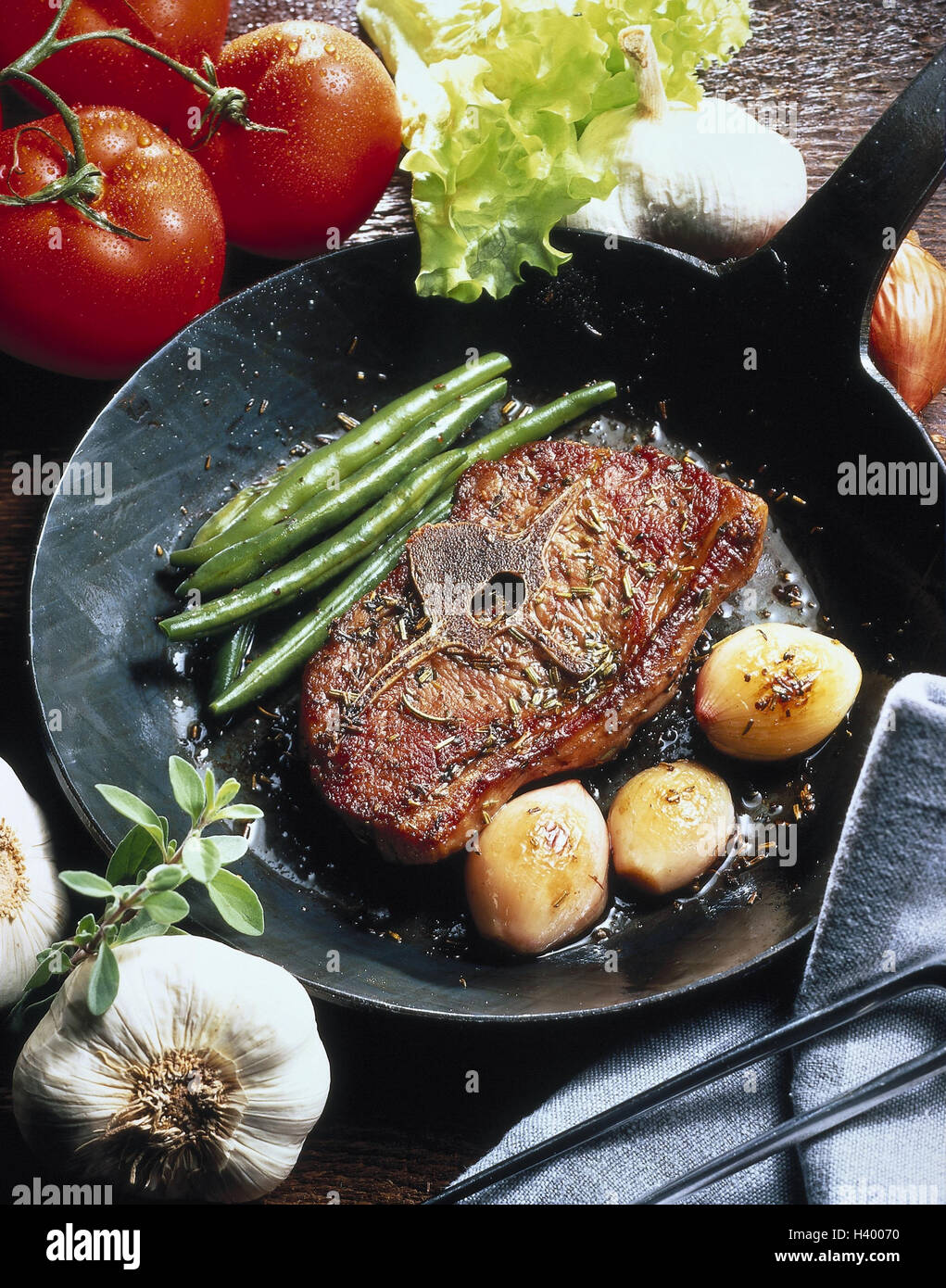 Cooking, pan, lamb chop, beans, bulbs, tomatoes, garlic, Still life ...