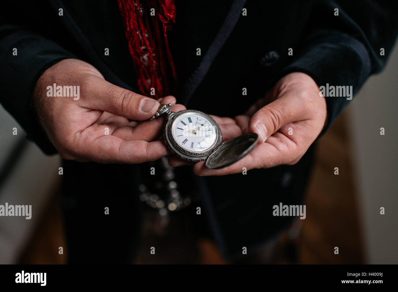 Man holding pocket watch Stock Photo - Alamy