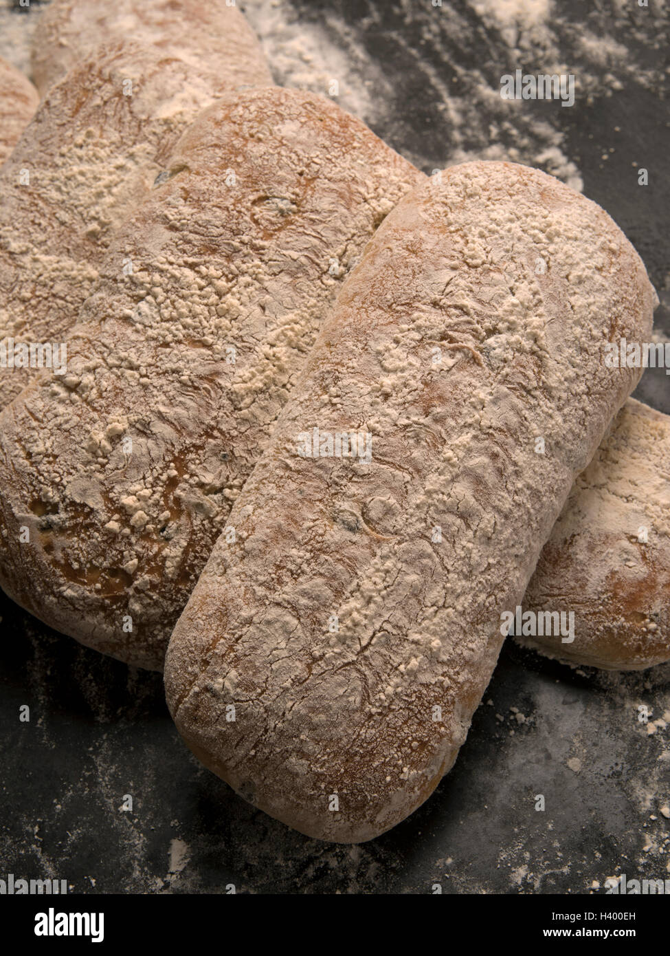 Ciabatta bread loaves on wooden background close up shot Stock Photo ...