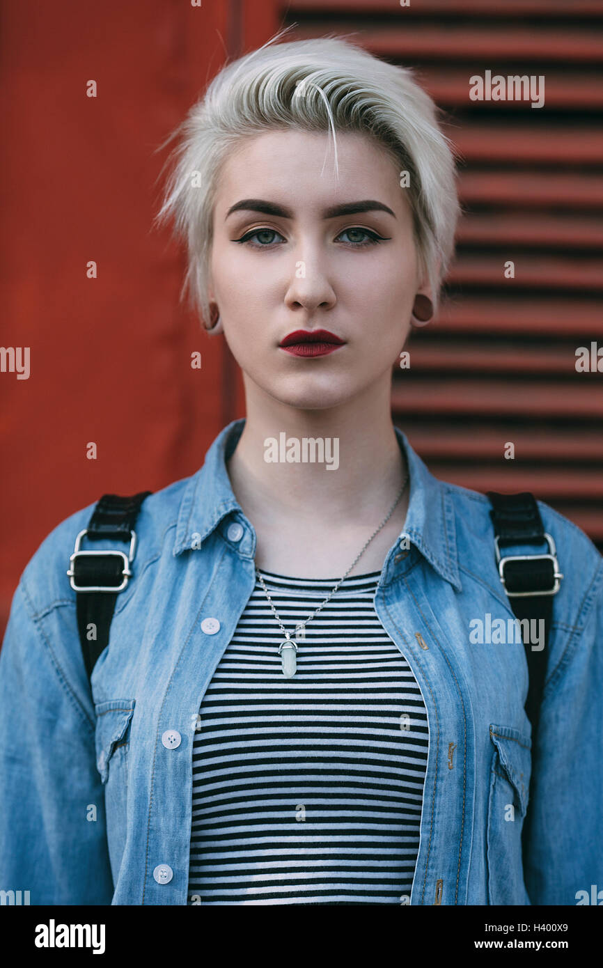 Beautiful woman standing front wall hi-res stock photography and images ...