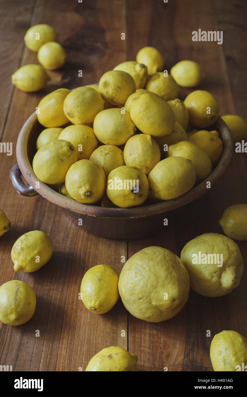 High angle view of lemons in container on table Stock Photo - Alamy