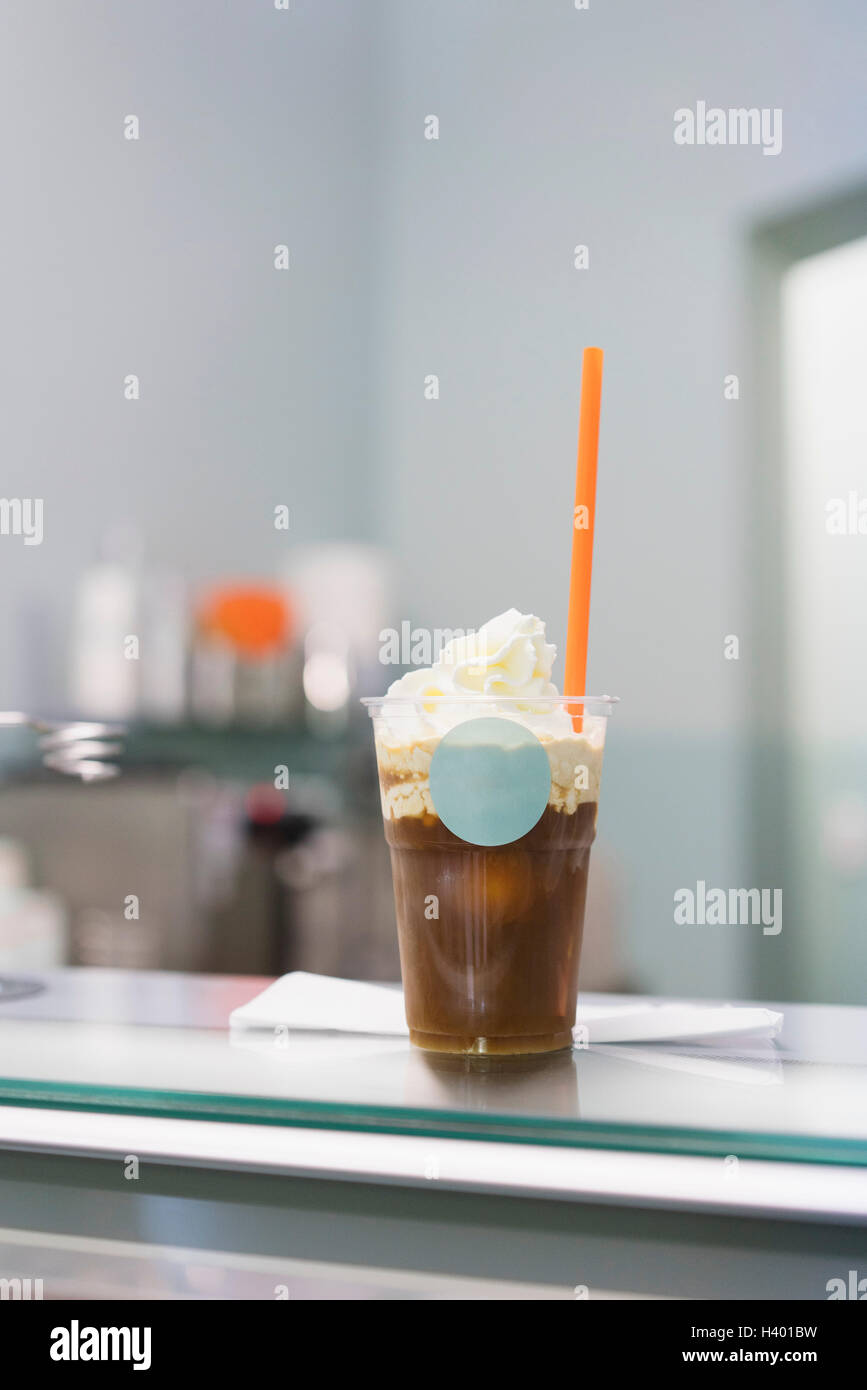 Close-up of iced coffee on counter at store Stock Photo - Alamy
