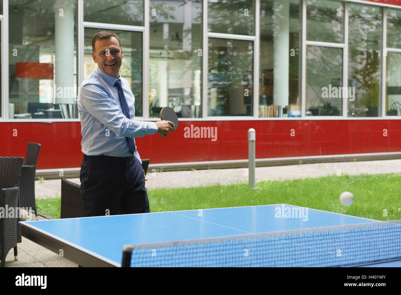 Business men playing table tennis hi-res stock photography and images ...