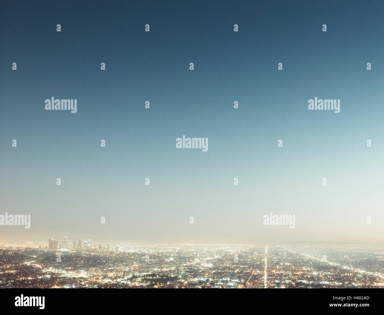 Aerial view of illuminated cityscape against blue sky, Los Angeles ...