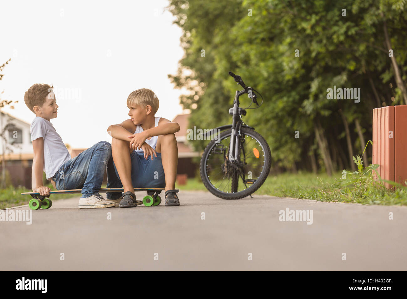 Man sitting on grass bicycle hi-res stock photography and images - Alamy