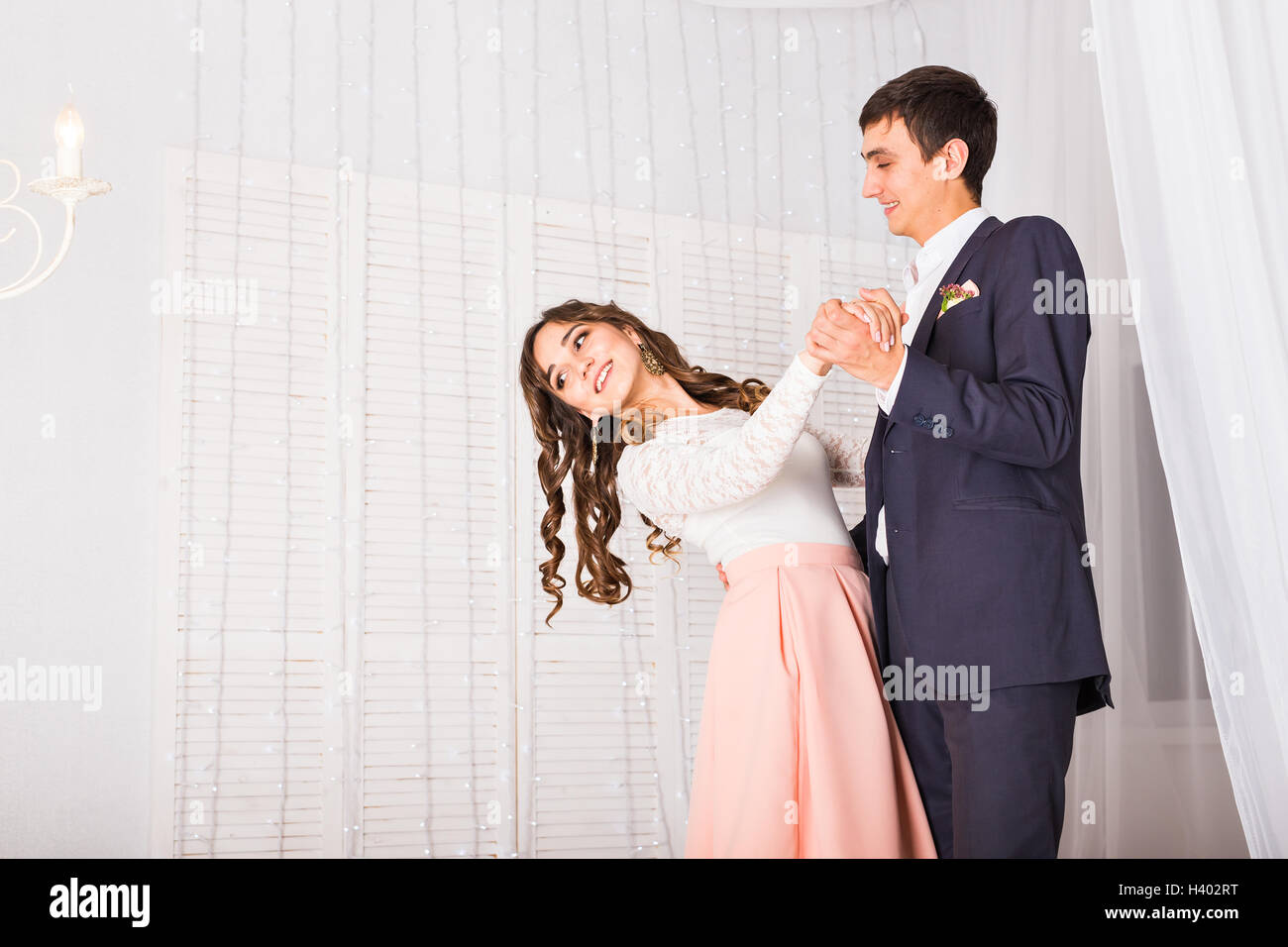 Young couple dancing in empty room Stock Photo - Alamy