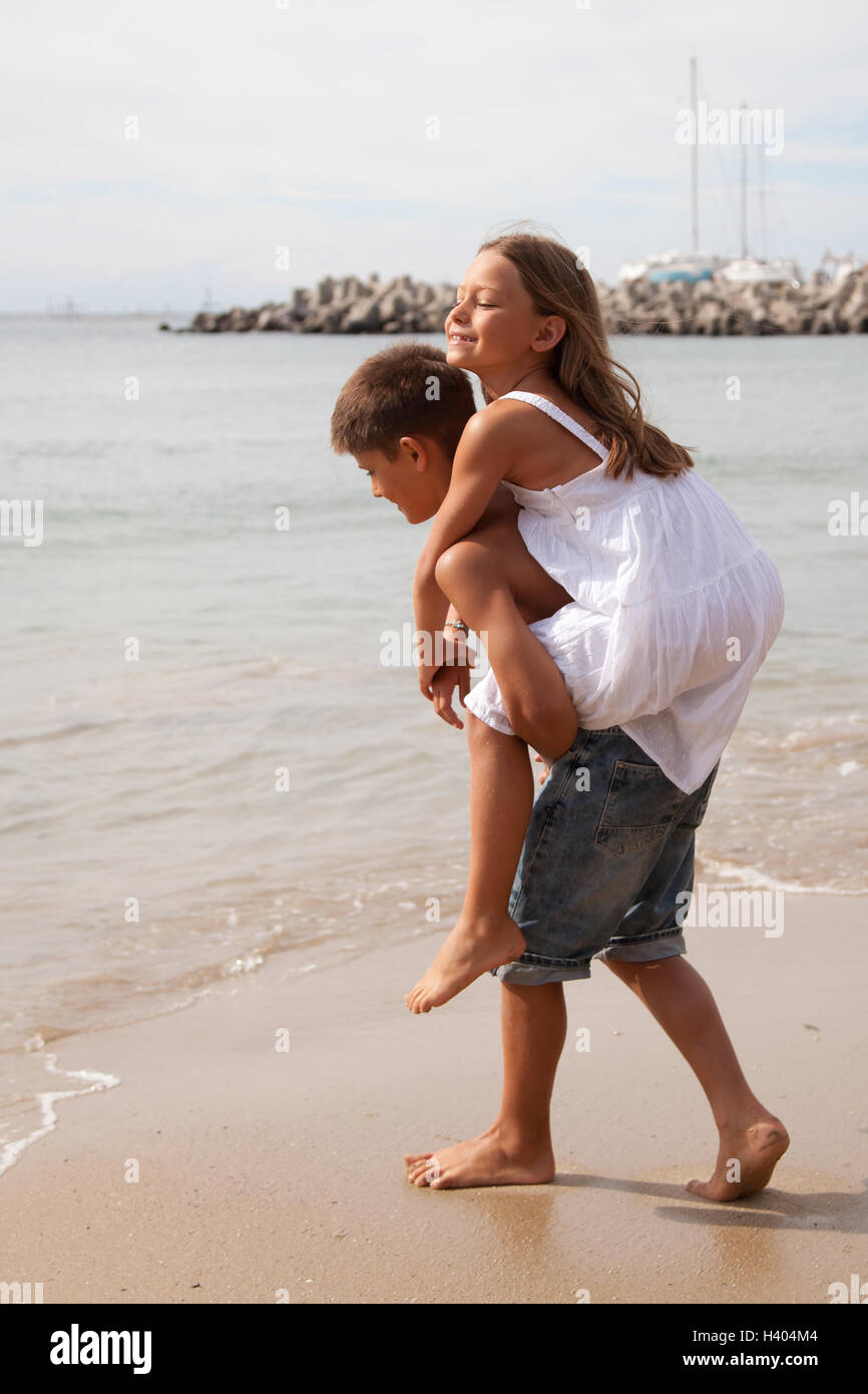 Child on piggyback hi-res stock photography and images - Alamy