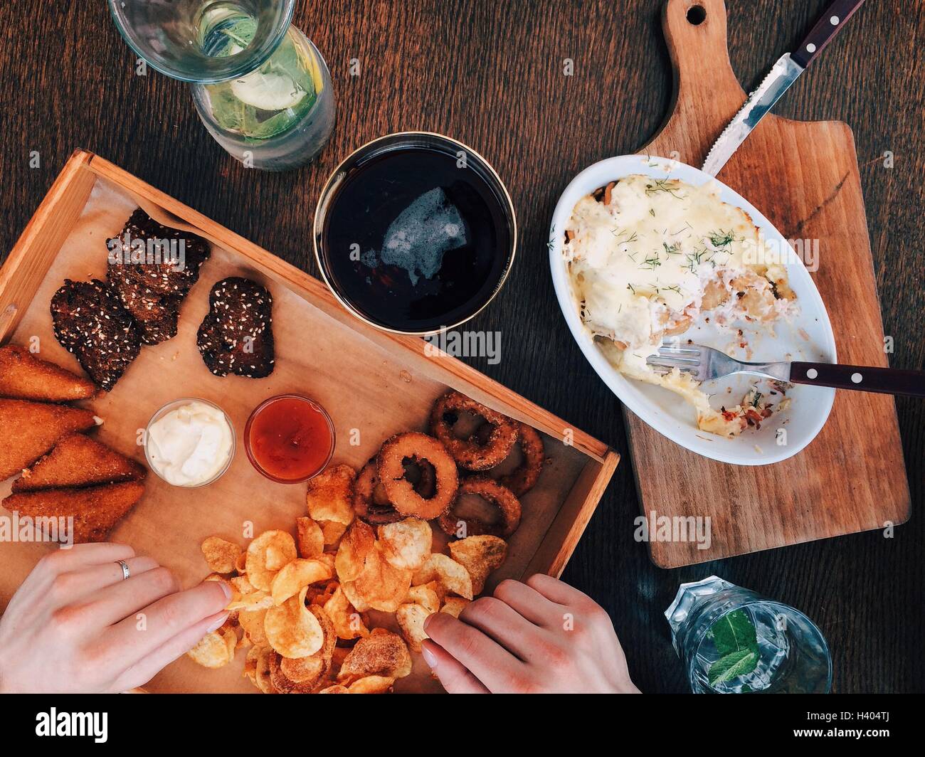 Black beer and bar snacks Stock Photo - Alamy
