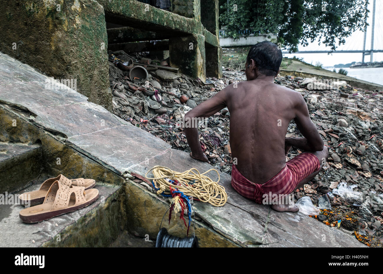 Back of a rag-picker on the Ganges shore in Kolkata, India Stock Photo ...