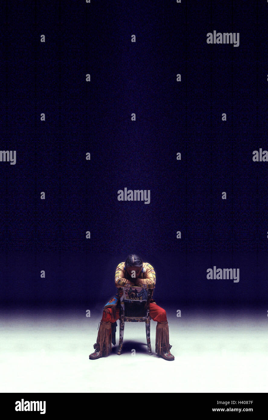 Native Americans, sits, chair, thoughtful Native American motives, man ...