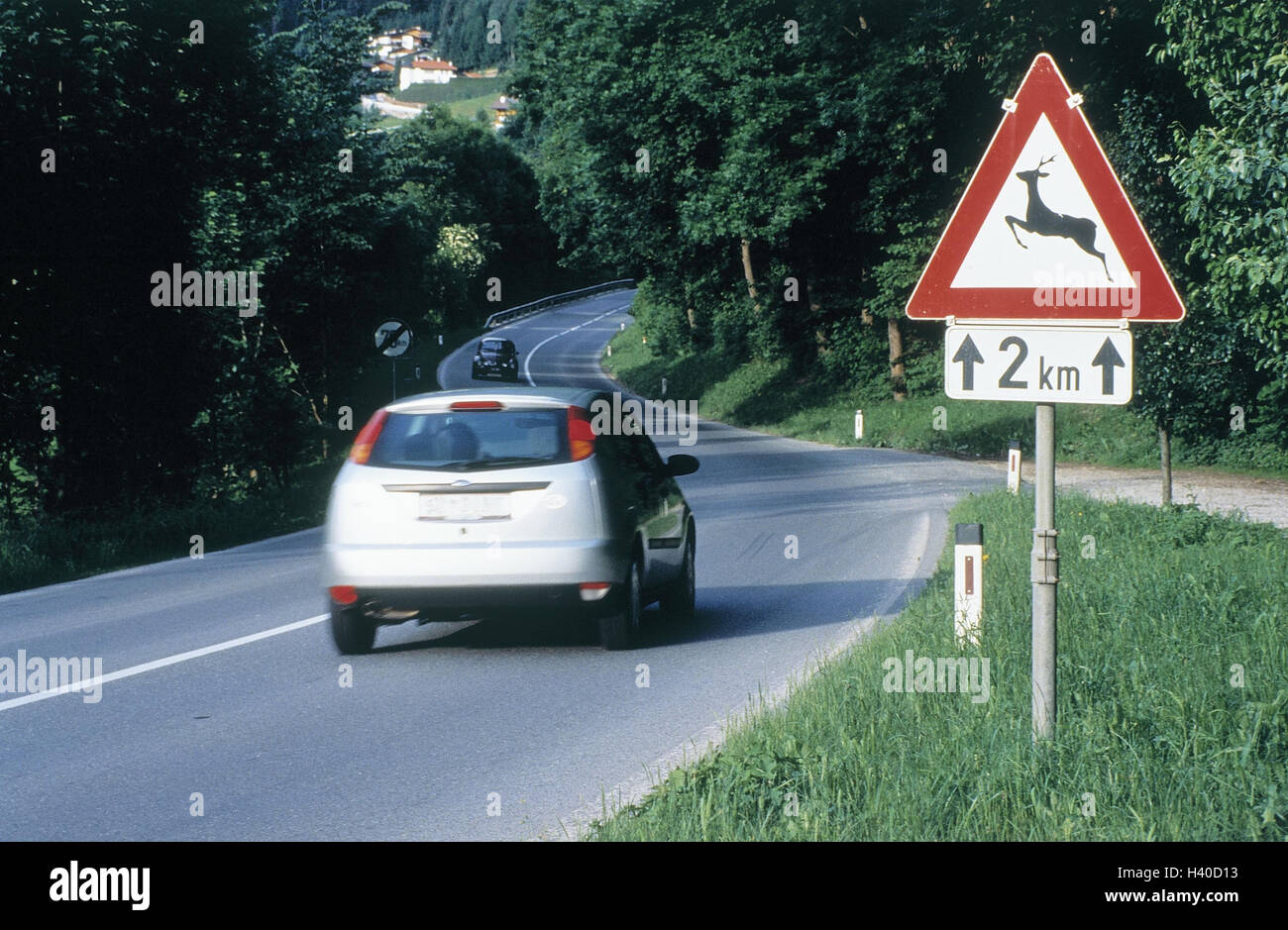 Country road, passenger cars, traffic signs, deer crossings, street ...