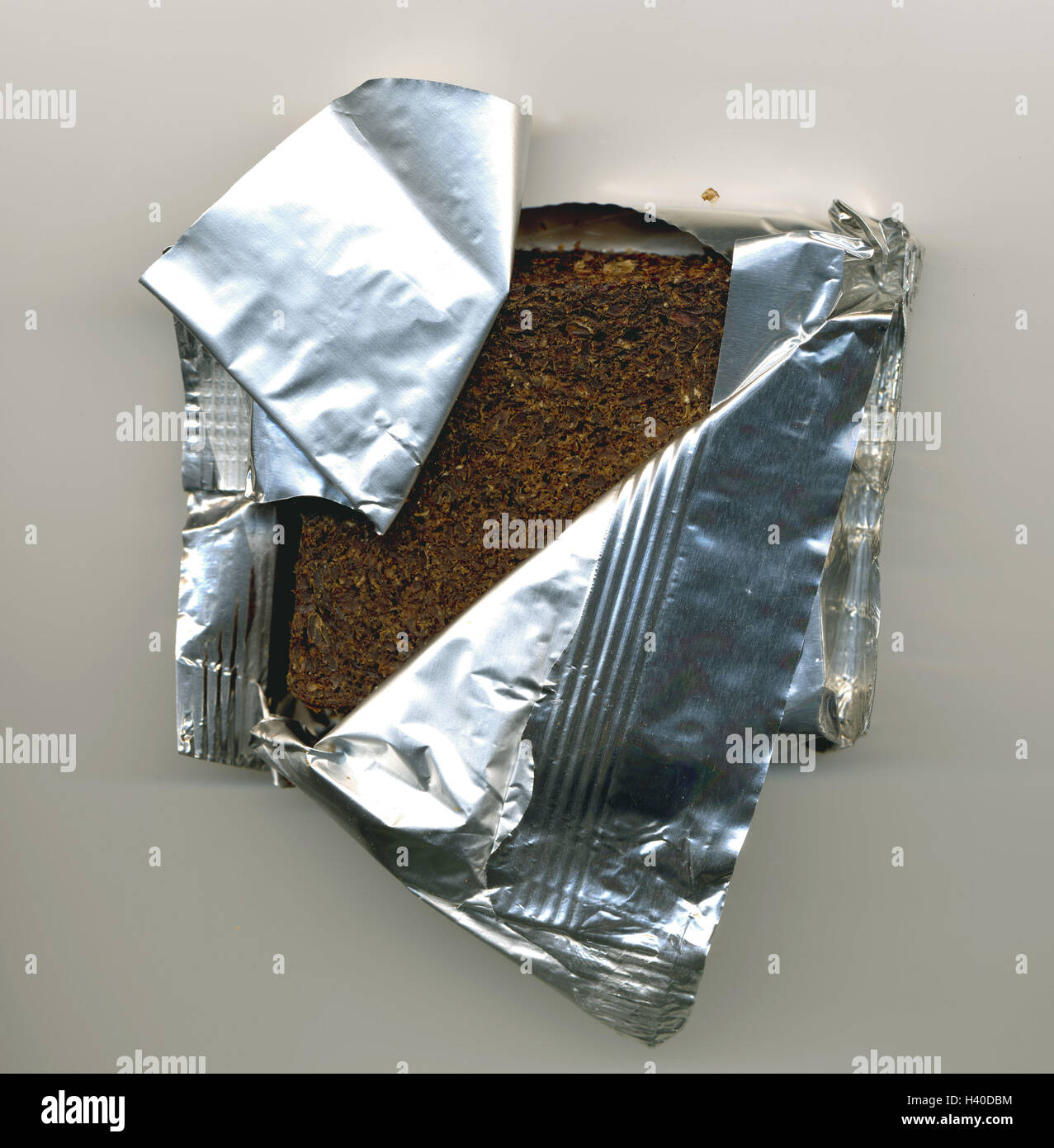 Aluminium envelope, opened, pumpernickel, slices brown bread, rye whole ...