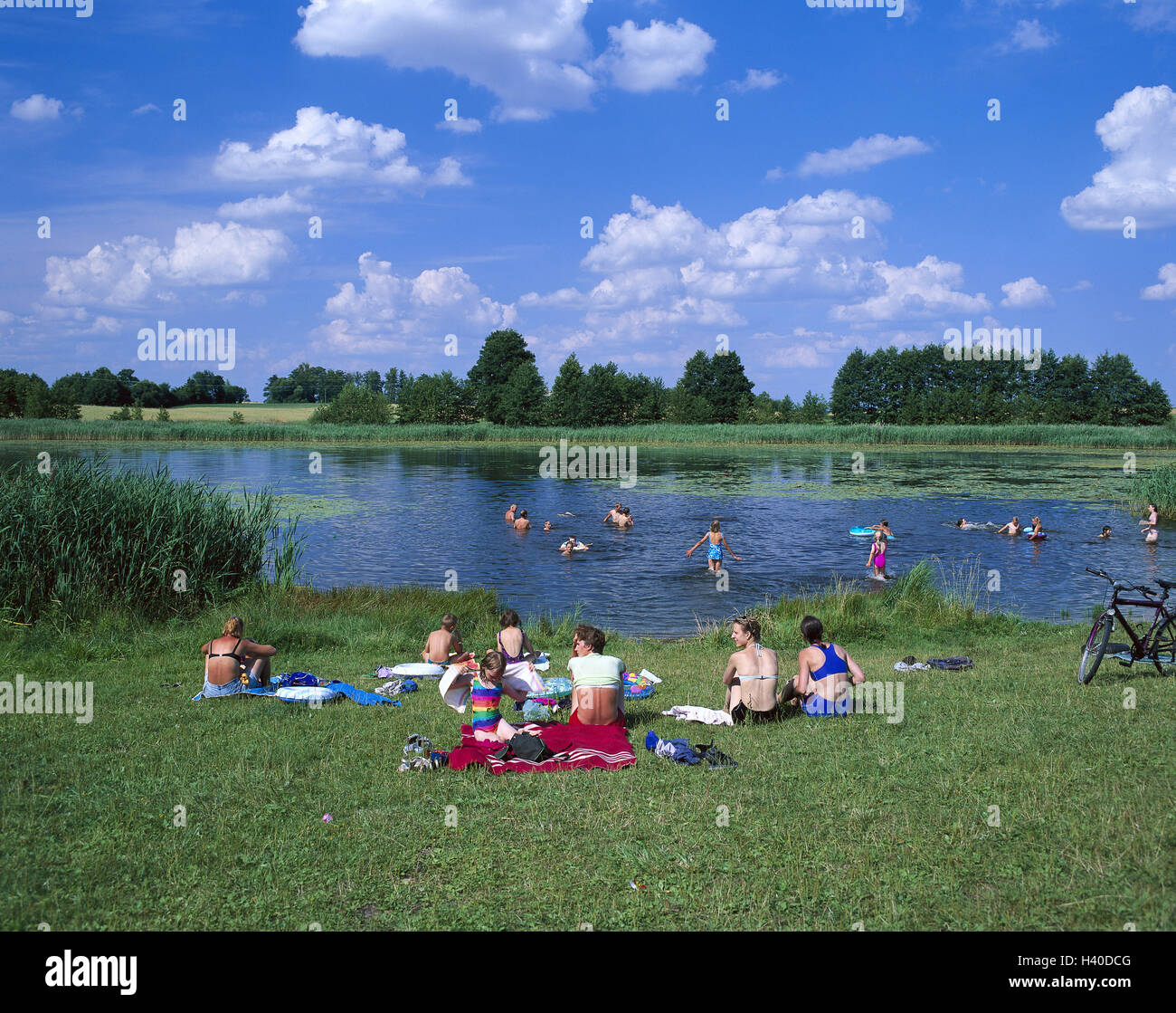 Poland, Masuria, close Lyck, lake, sunbathing area, young persons ...