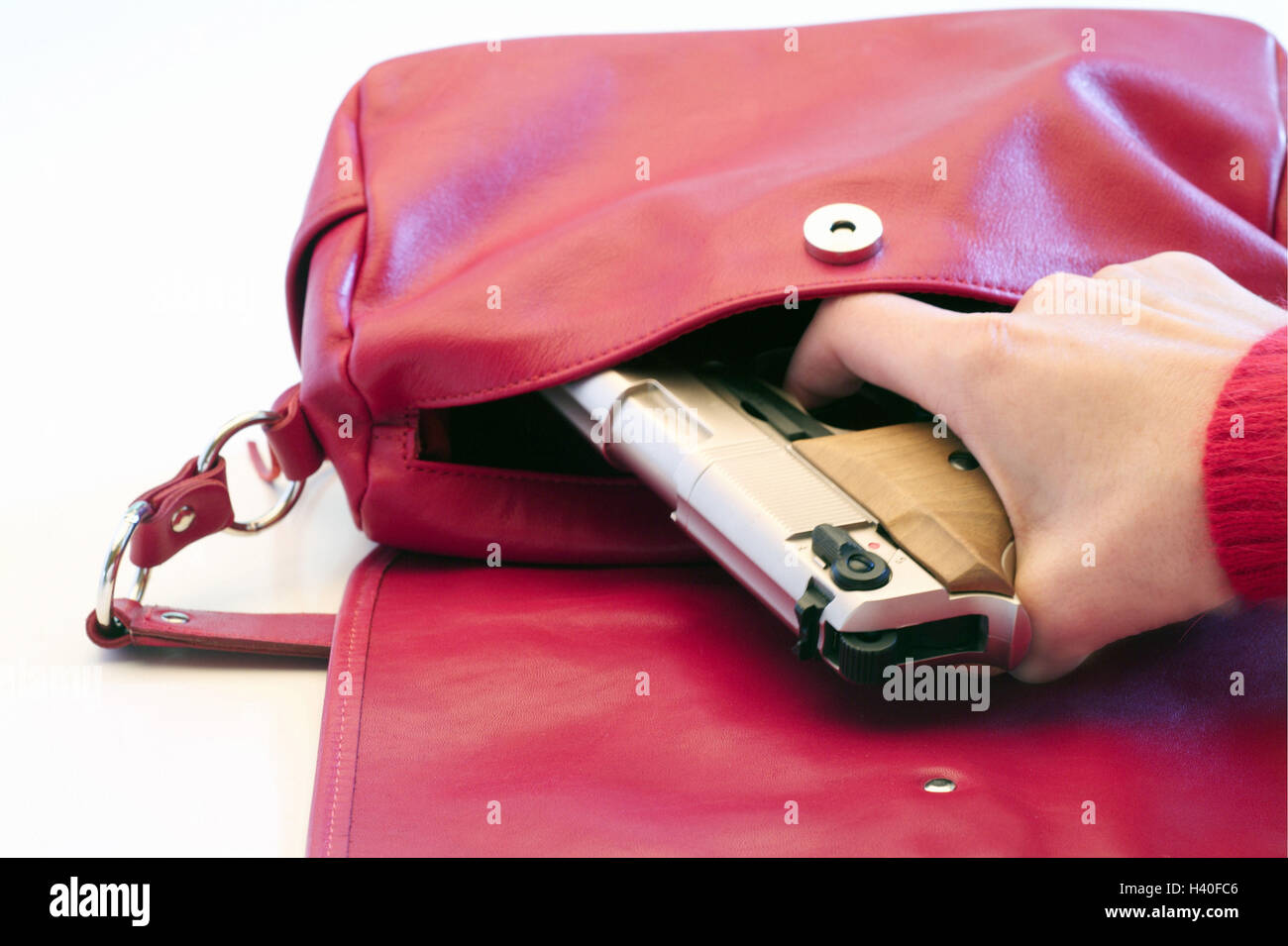 Handbag with gun hi-res stock photography and images - Alamy