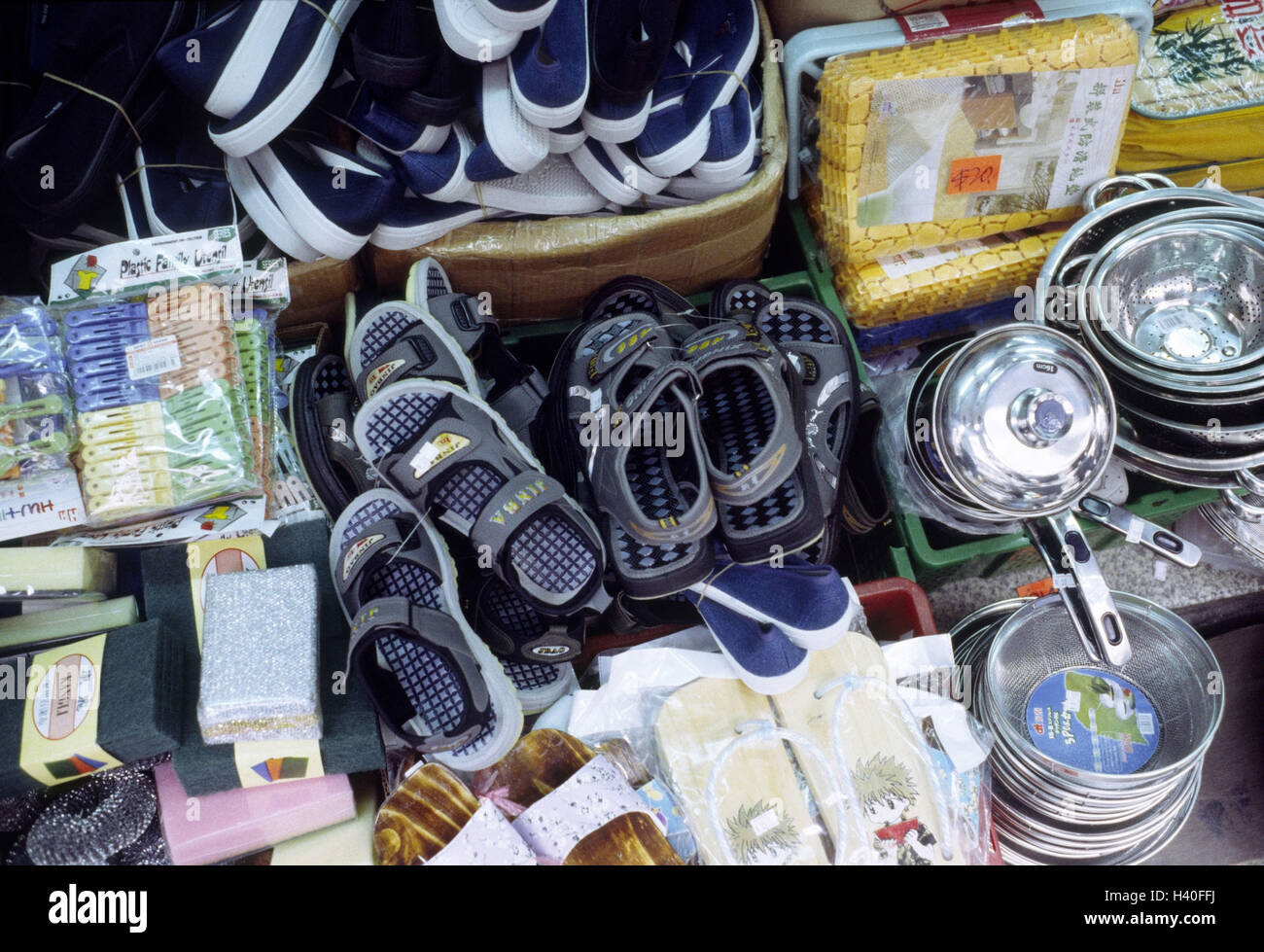China, Hong Kong, market stall, detail, sales, shoes, frying pans, pots ...