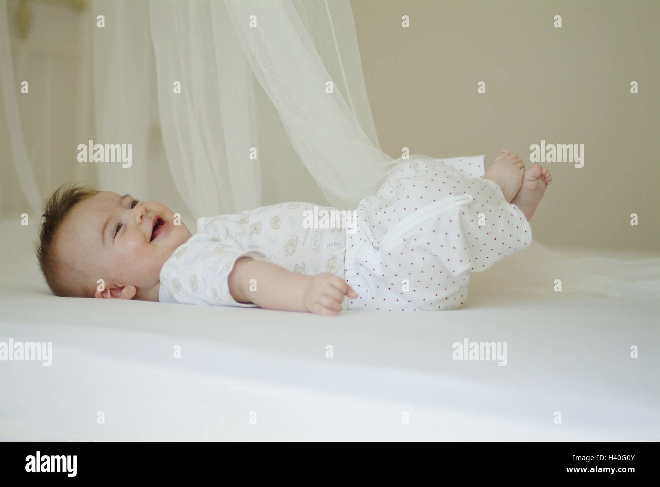 Baby, lie, feet, mosquito net, side view, whole body, back position ...
