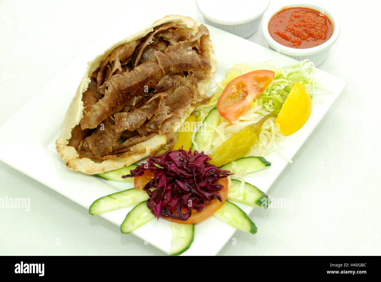 Doner kebab in pita bread & salad Stock Photo - Alamy