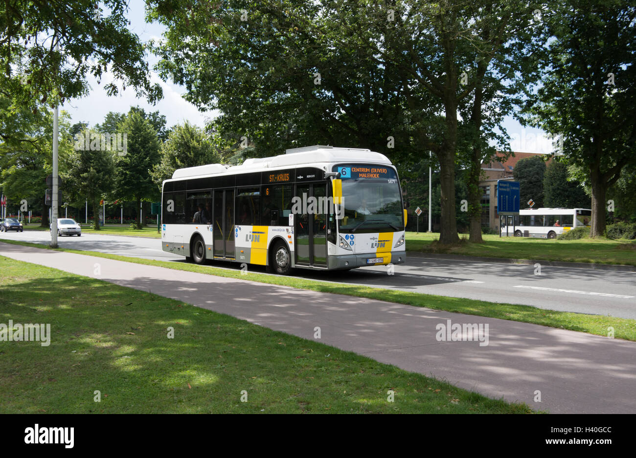 A De Lijn Hybrid bus heads towards the center of Bruges, Belgium. The bus is a Van Hool New A309 ...