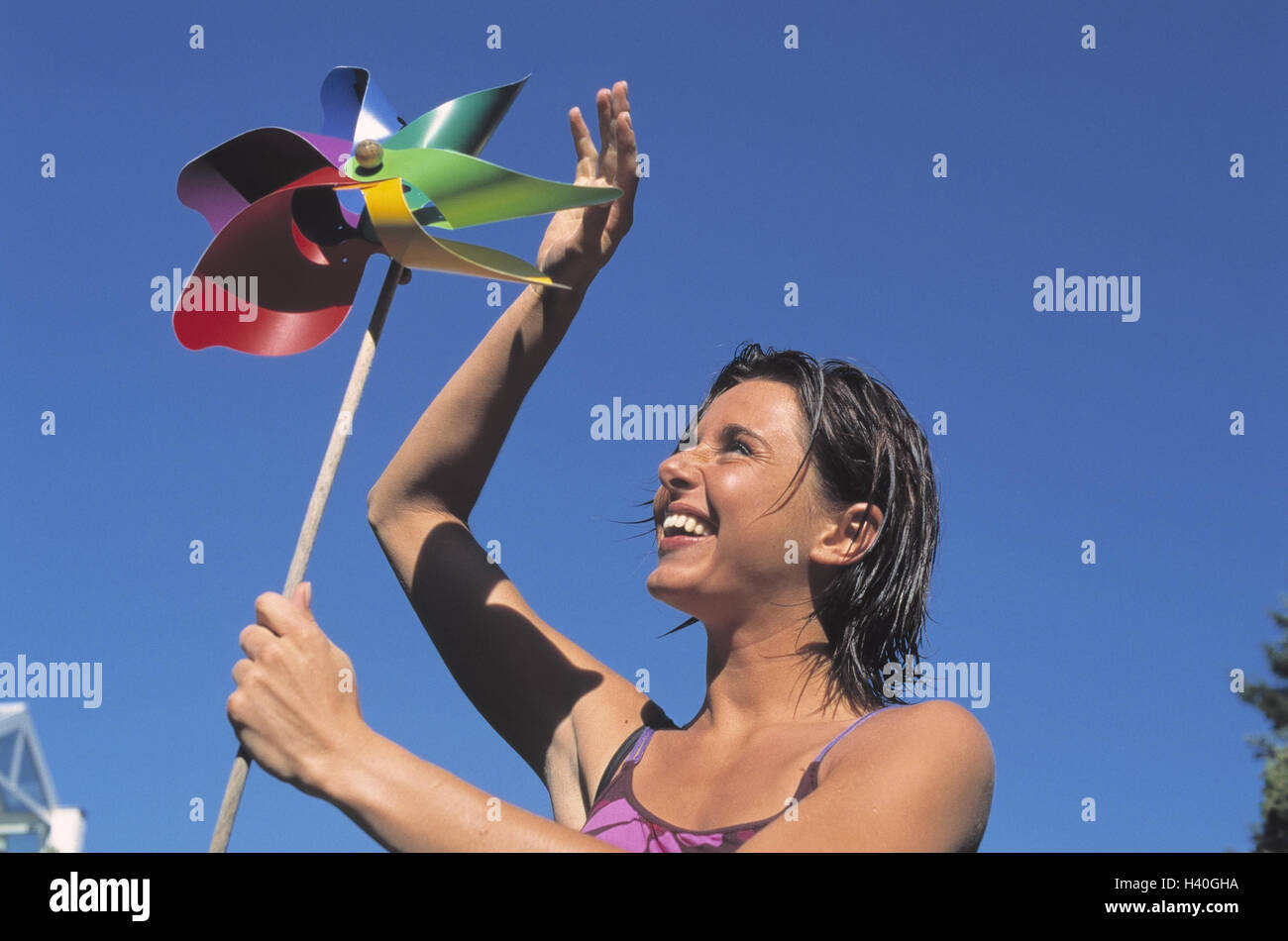 Woman, wind turbine, laugh, happy, side view, detail, model released ...