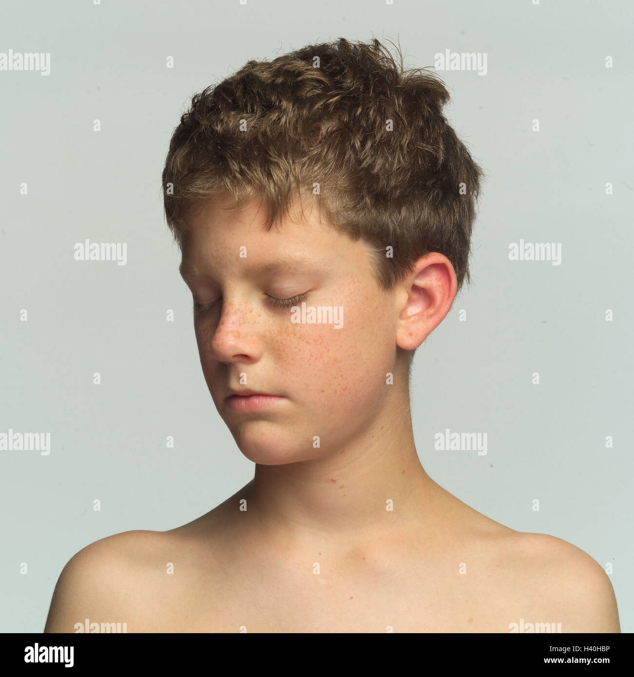 Boy, eyes closed, free upper part of the body, page portrait, model ...