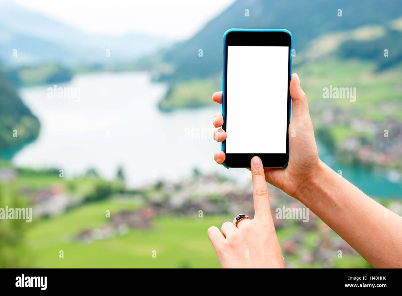 Phone on the landscape background Stock Photo - Alamy
